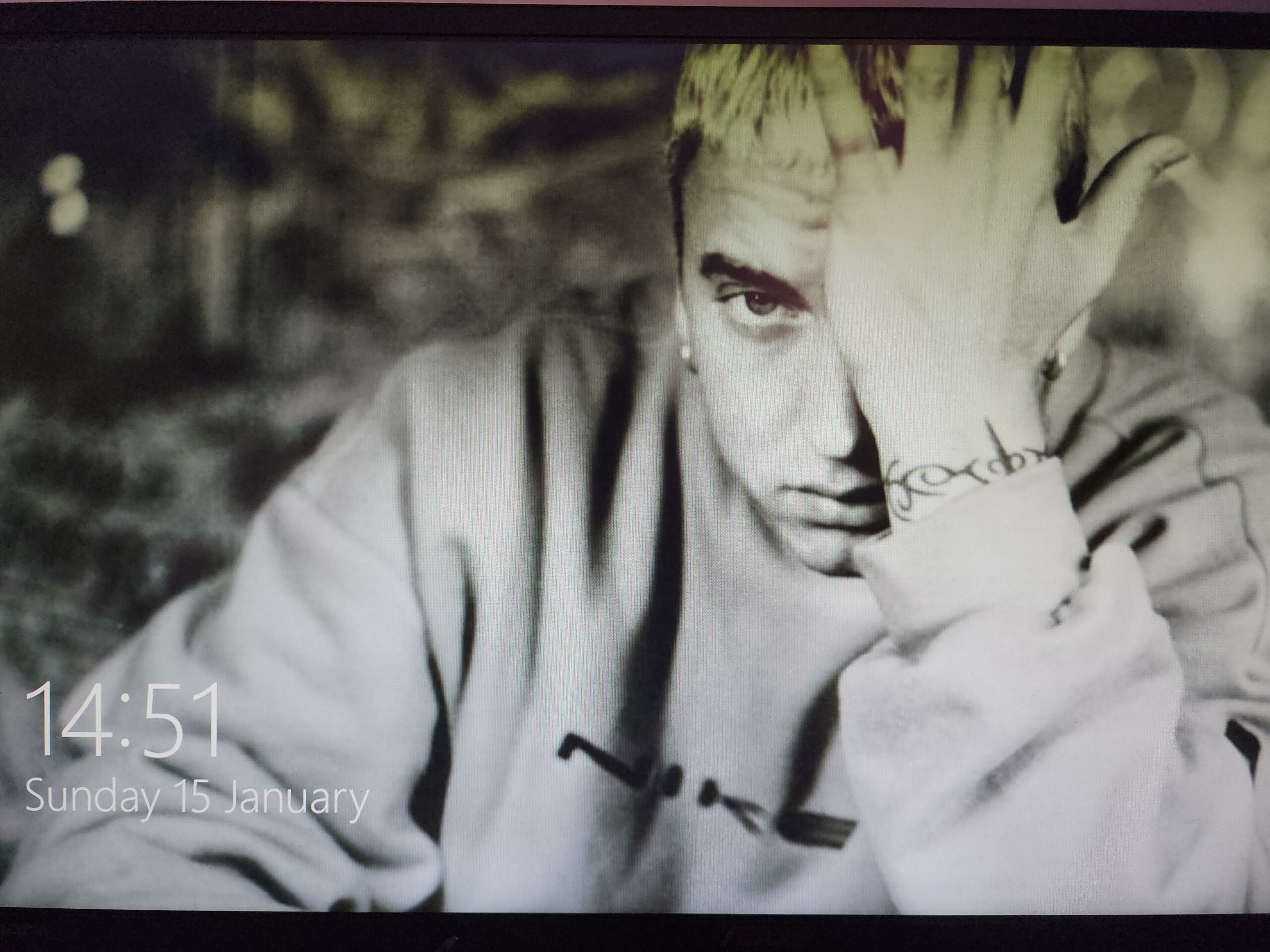 Everytime my PC restarts after an update, this photo of Eminem shows up ...